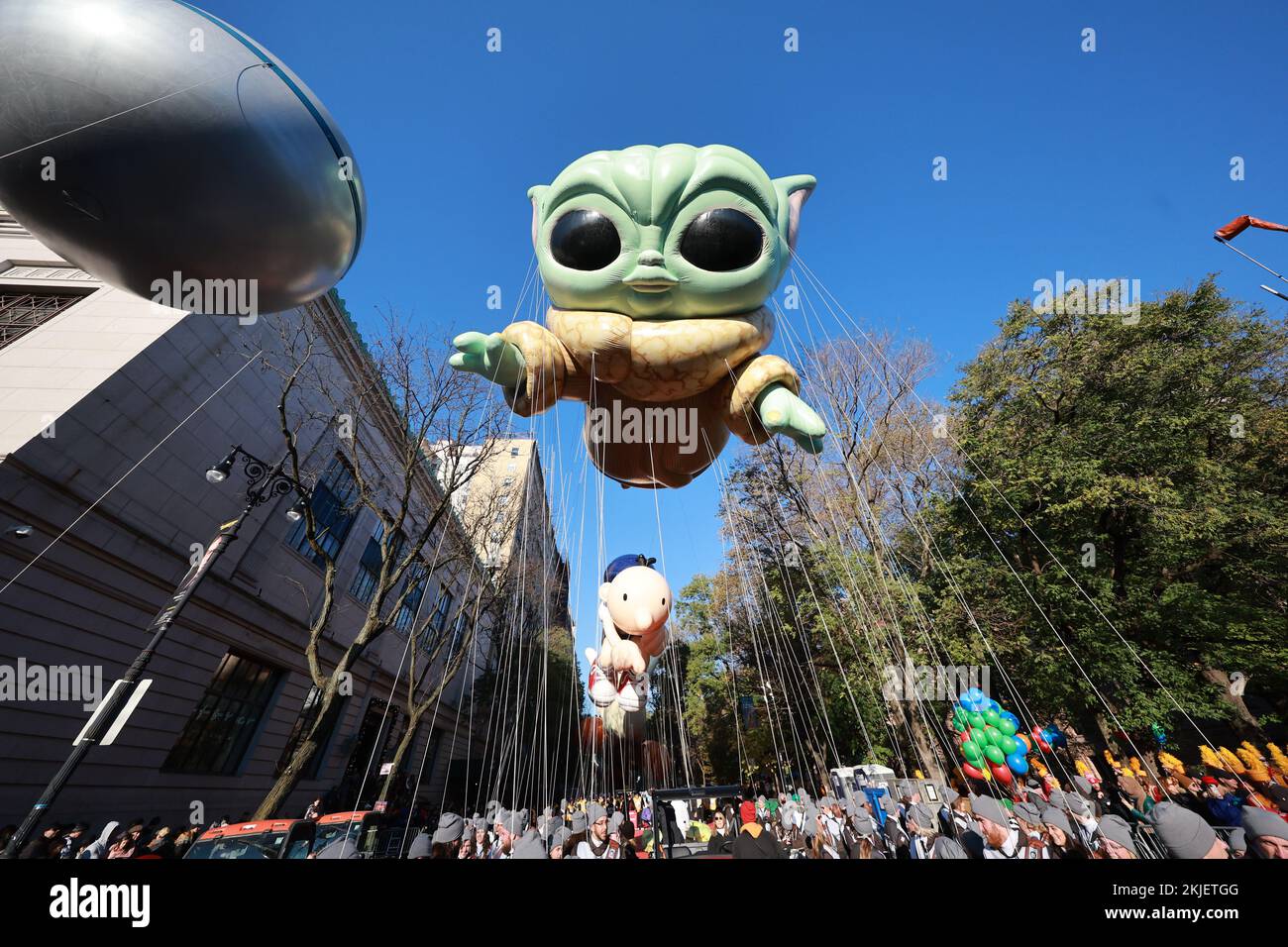 NEW YORK, NEW YORK - November 24, 2022: The Grogu balloon is led down ...