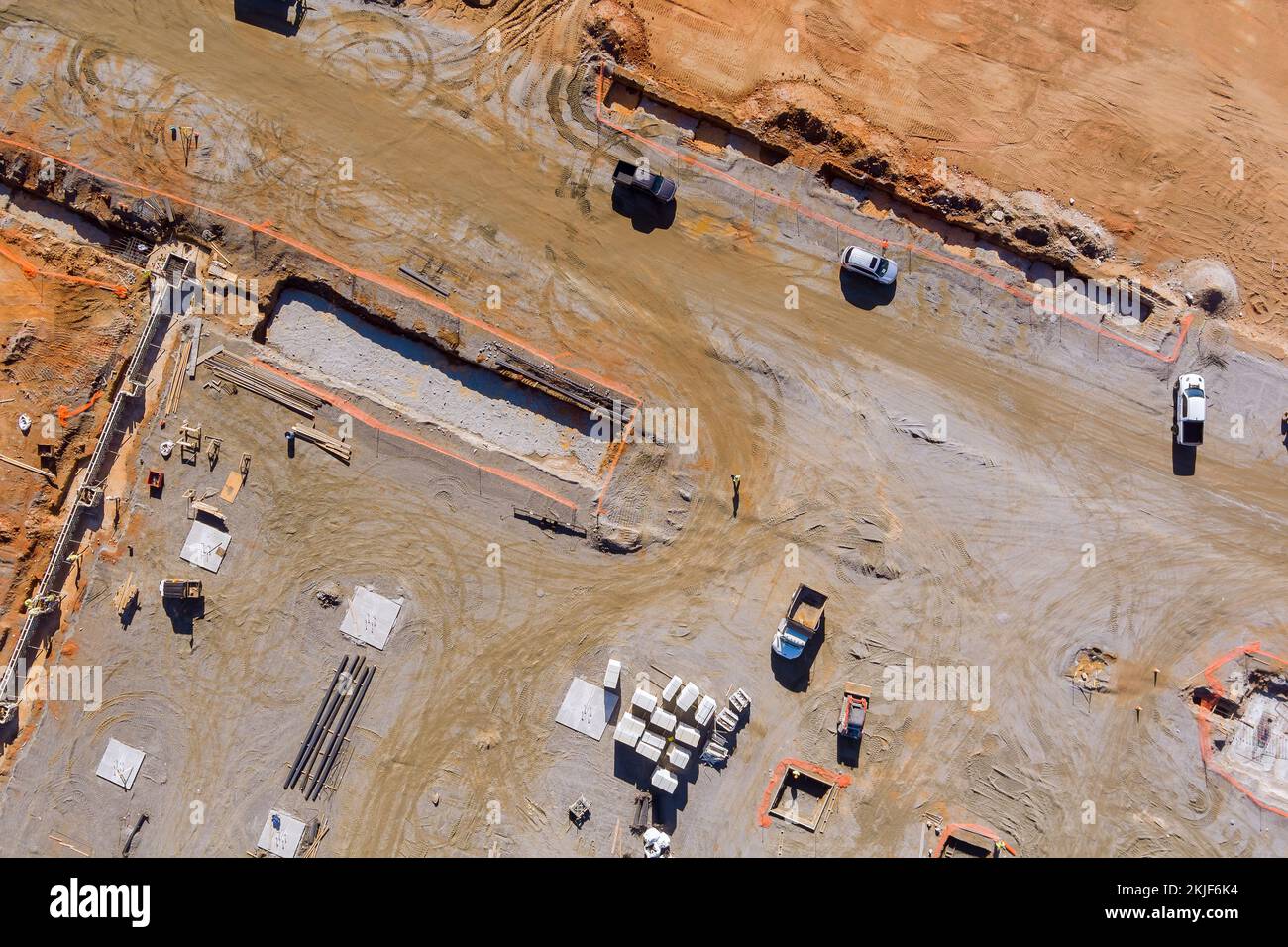 Trenches are being dug on construction site in order to pour concrete ...