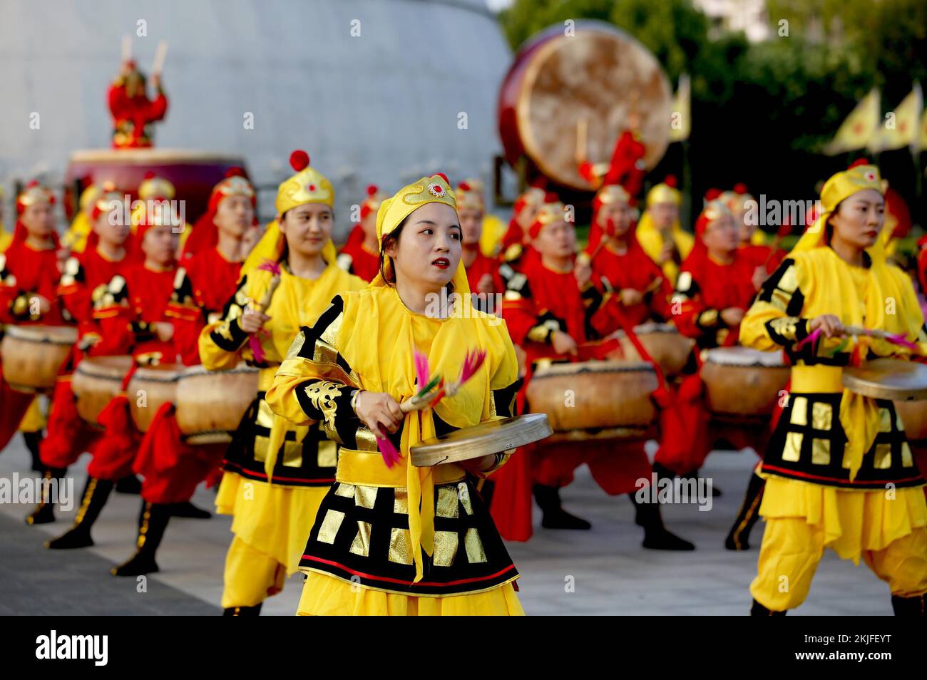 People are performing a show called "Weifeng Gongs and Drums" which is ...