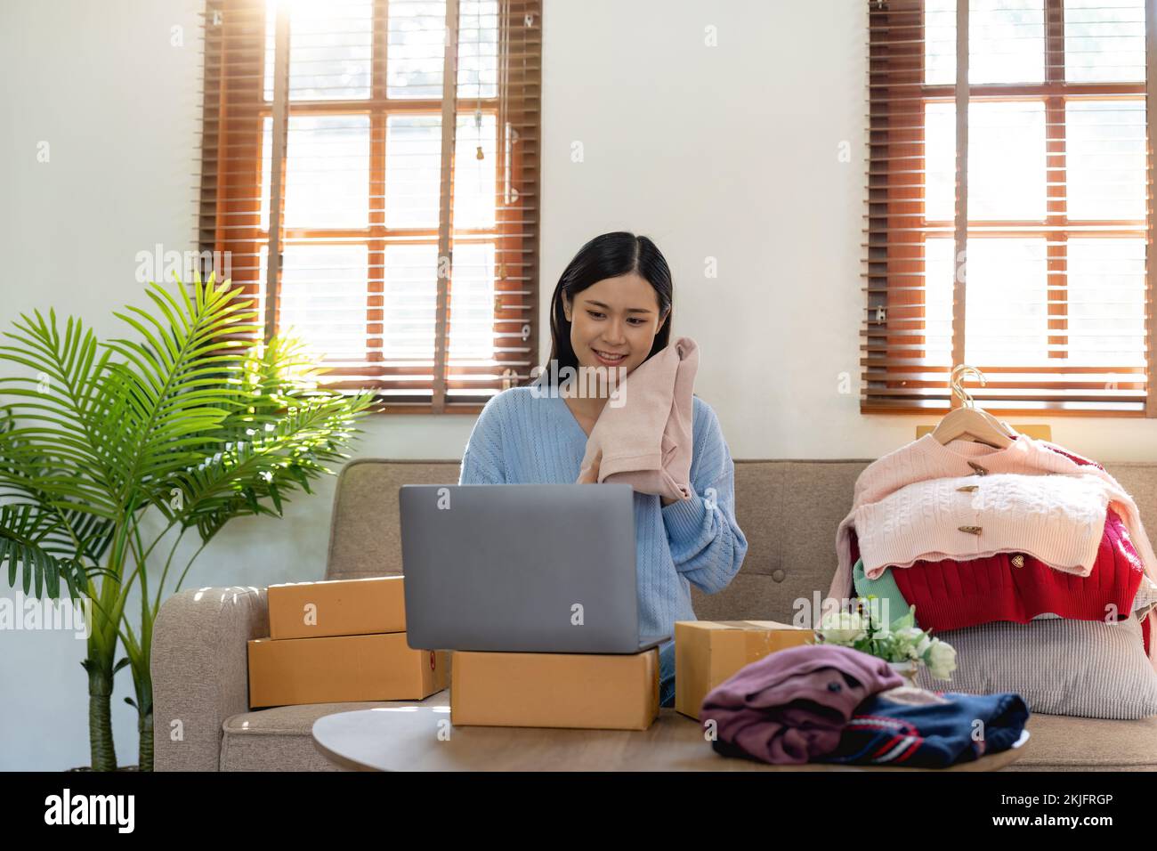 Beautiful woman review clothes and talking camera live recording video ...