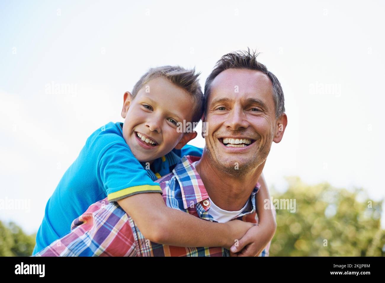 My dad is my hero. A cropped portrait of a happy father giving his young son a piggyback ride ...