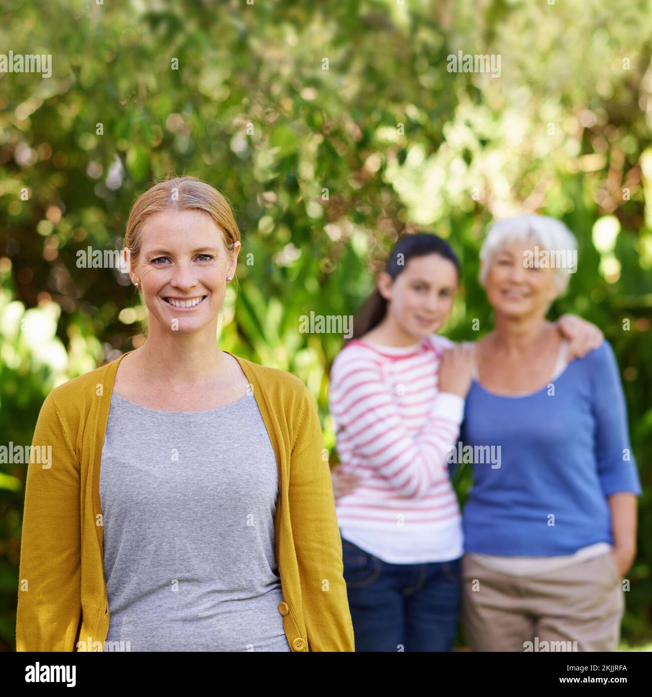 Family love. three generations of family women standing outdoors Stock ...