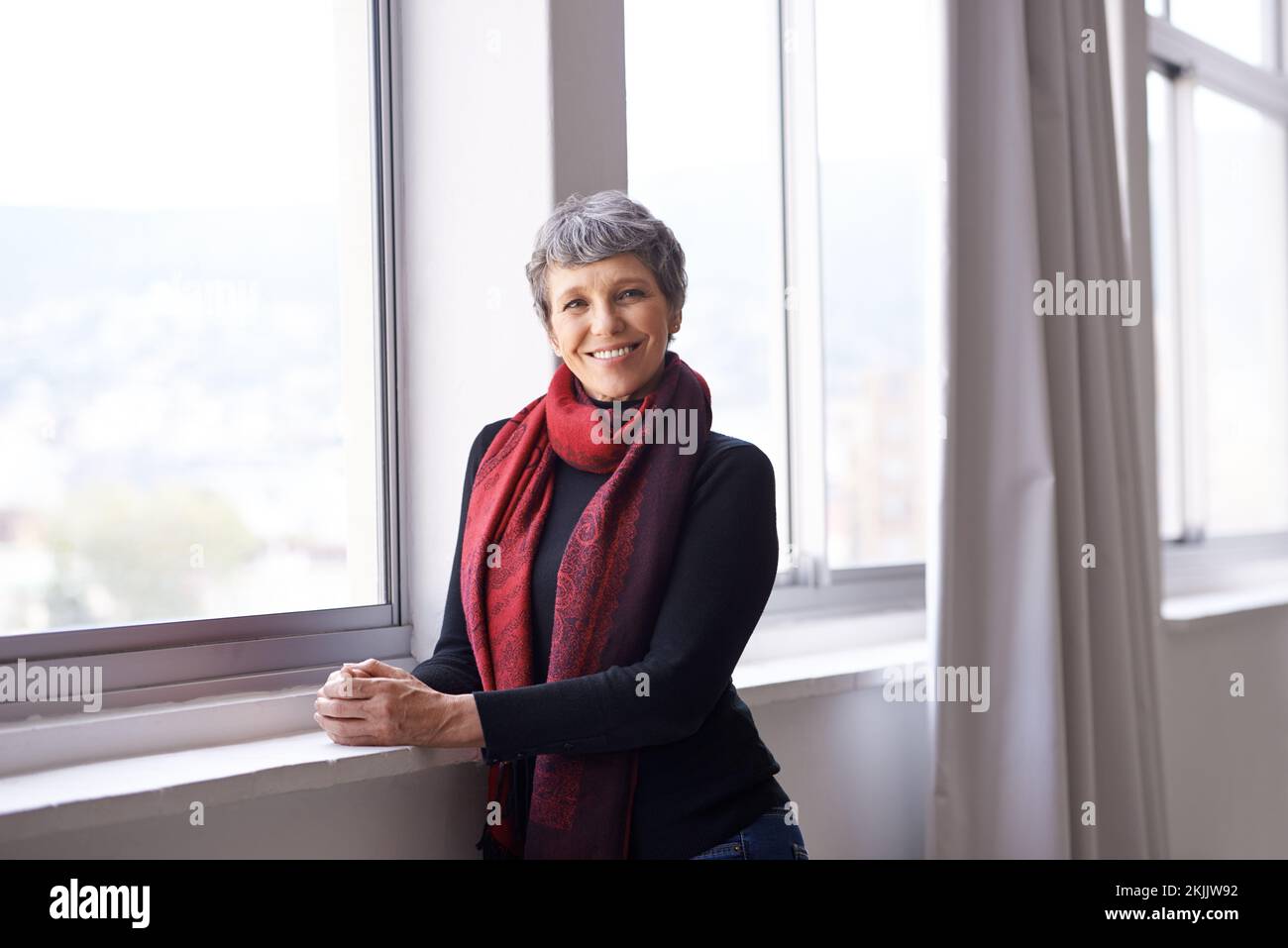 Count your age by smiles. Portrait of a beautiful senior woman leaning ...