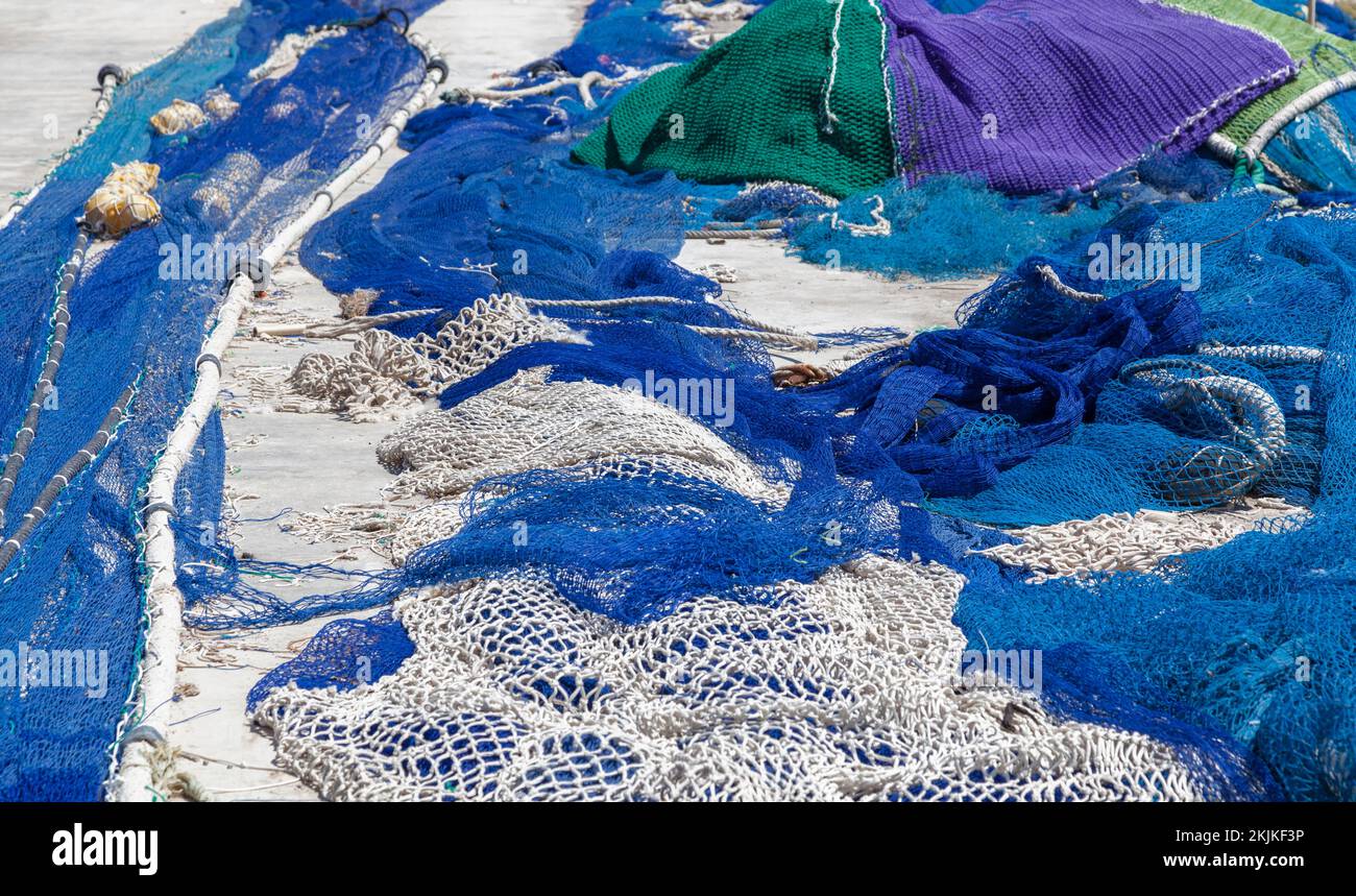 Colourful fishing nets and ropes laid out to dry, Port de Soller ...