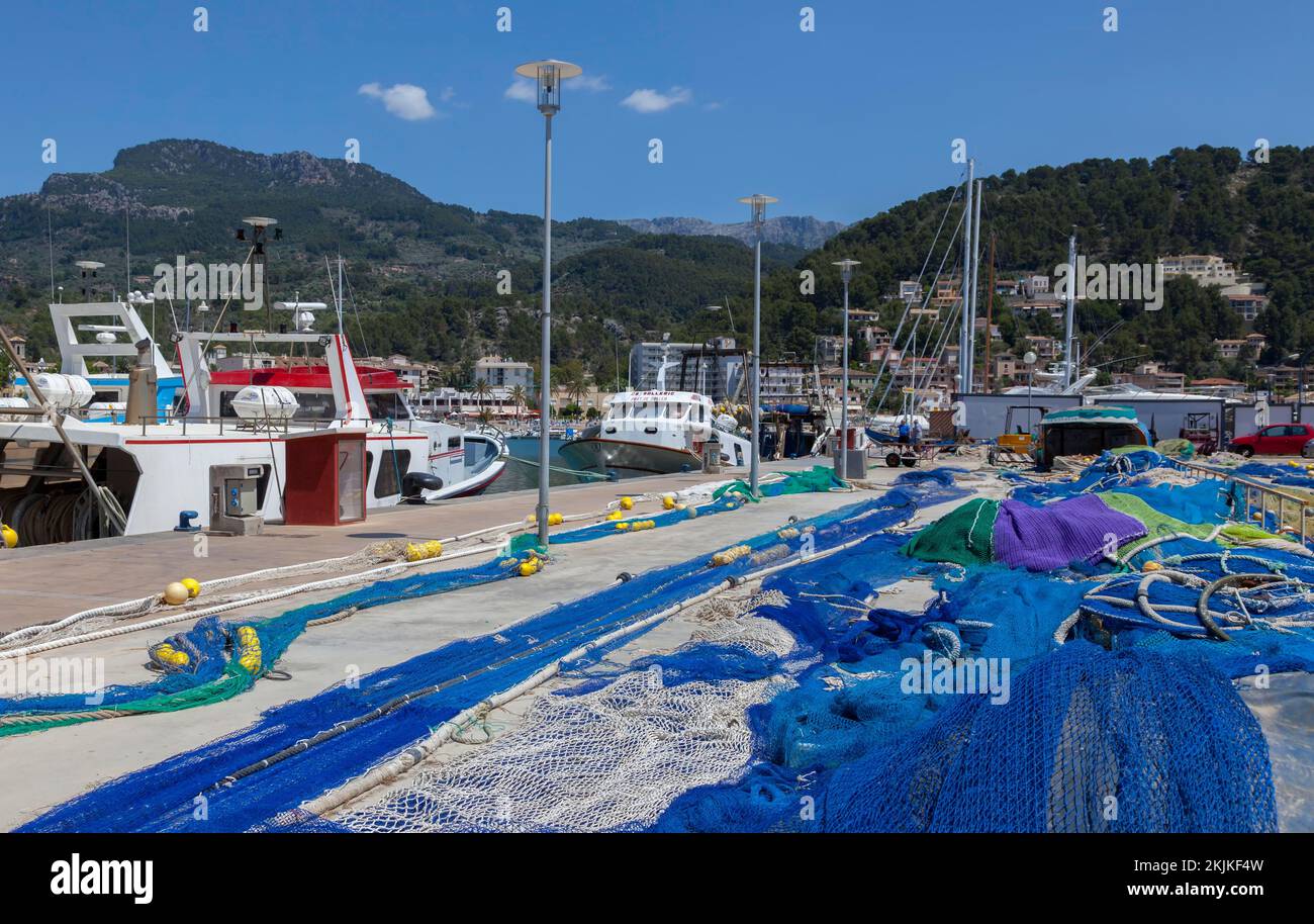 Colourful fishing nets and ropes laid out to dry, Port de Soller ...