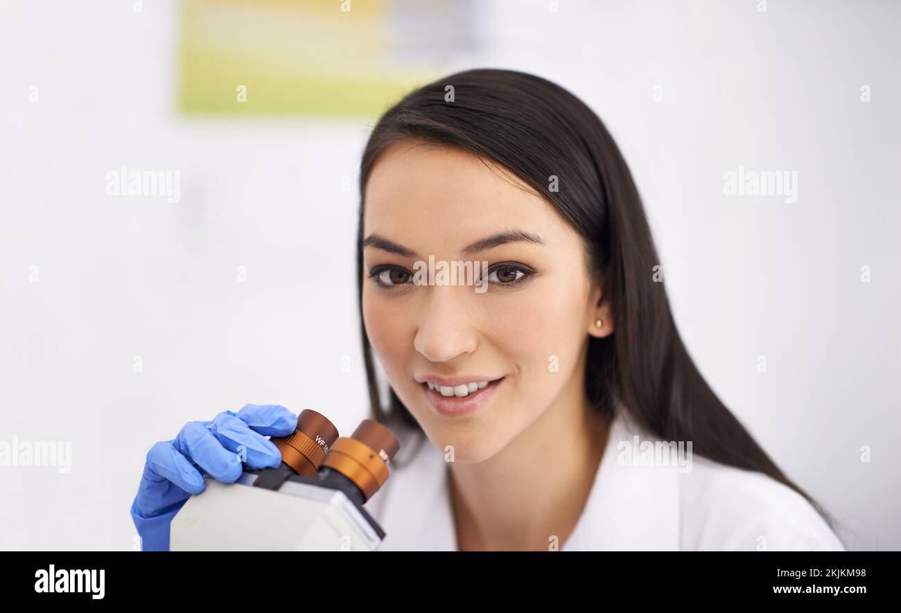 She has a scientific mind. Portrait of a female scientist using a ...