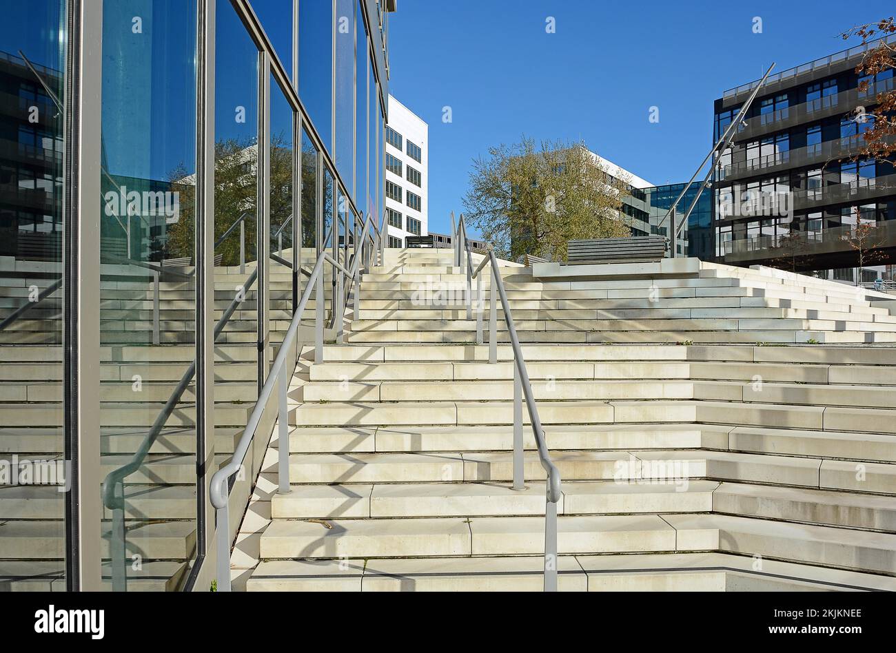 Modern office building, window front with reflection, steps in the ...
