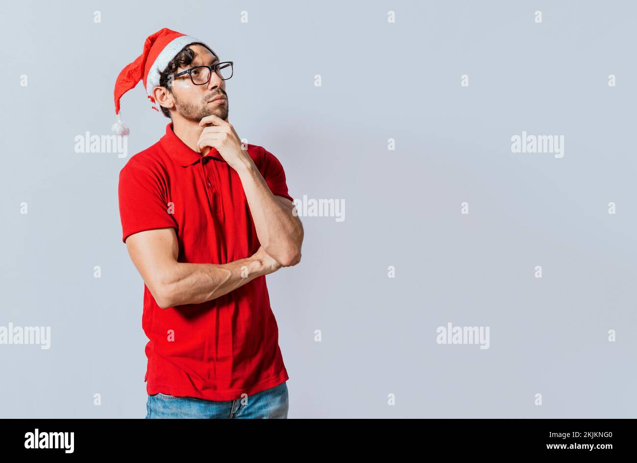 Thoughtful christmas man looking aside. Christmas handsome guy with ...