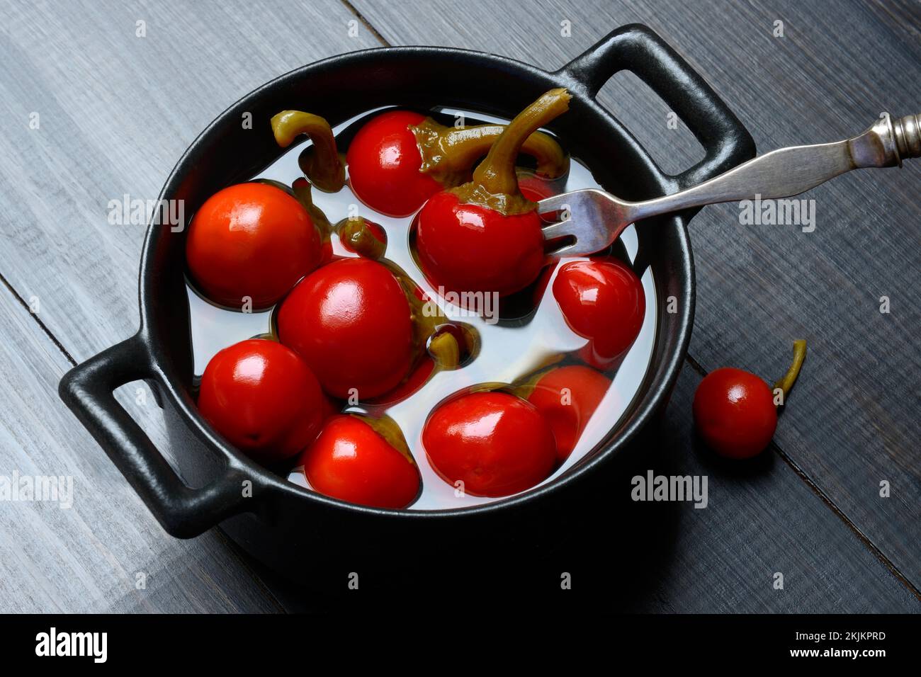 Potted cherry peppers in vinegar, chilli, paprika Stock Photo - Alamy