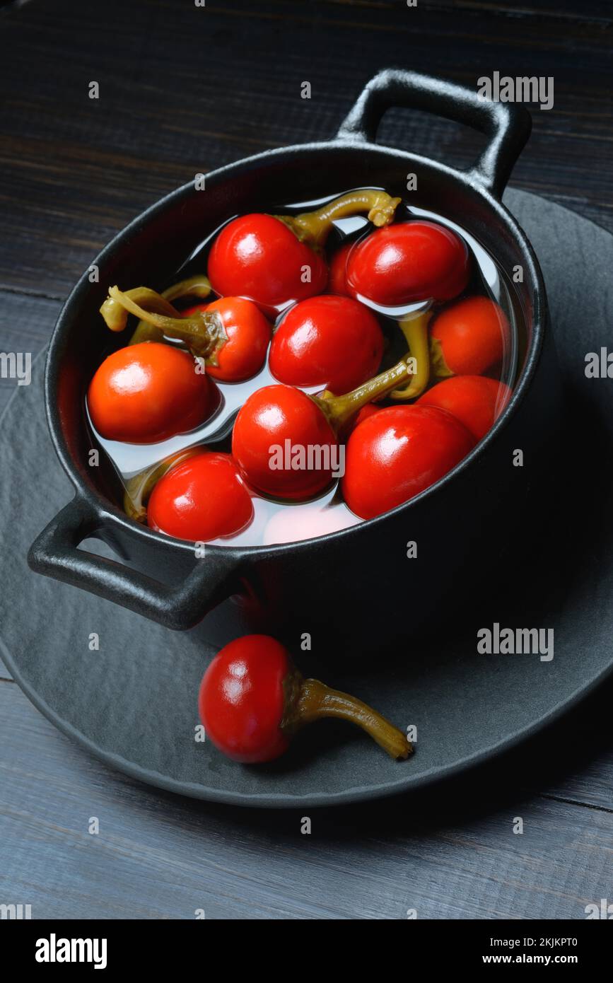 Potted cherry peppers in vinegar, chilli, paprika Stock Photo - Alamy