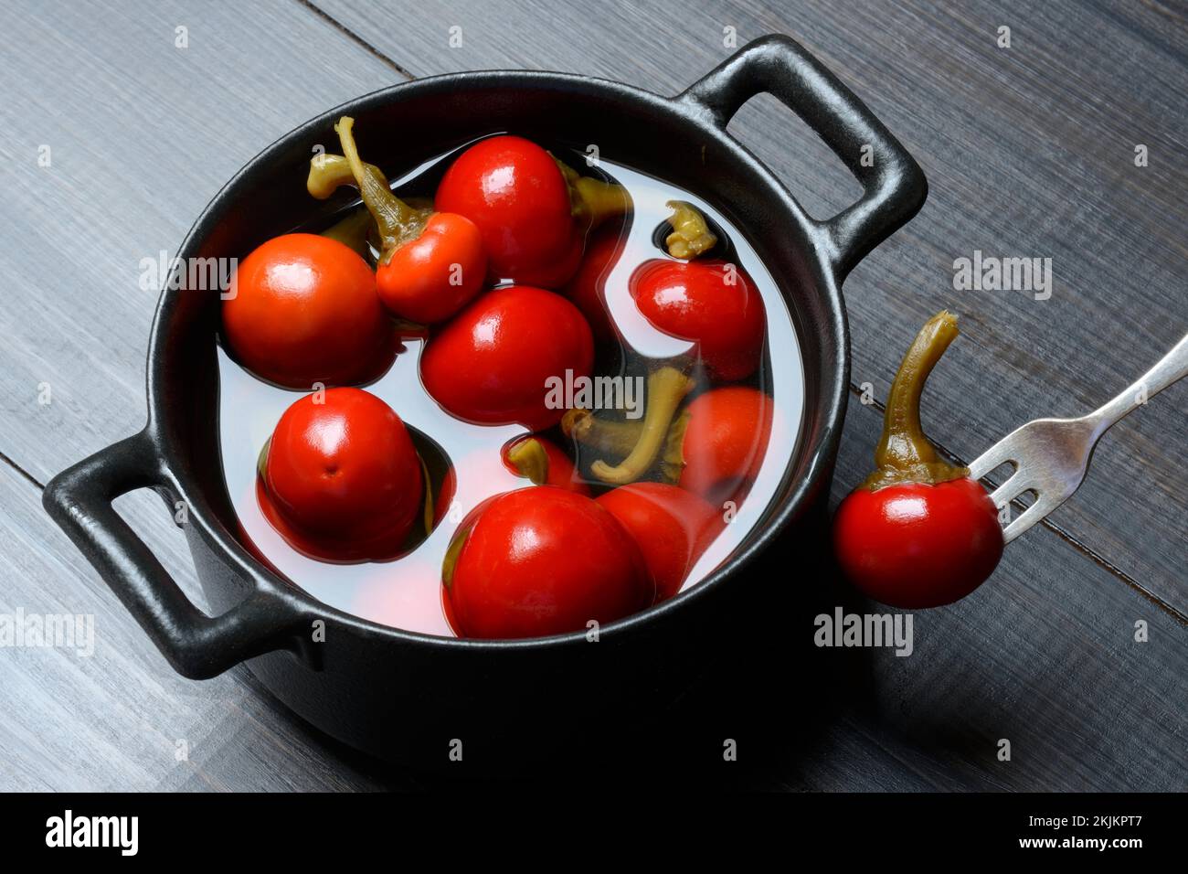 Potted cherry peppers in vinegar, chilli, paprika Stock Photo - Alamy