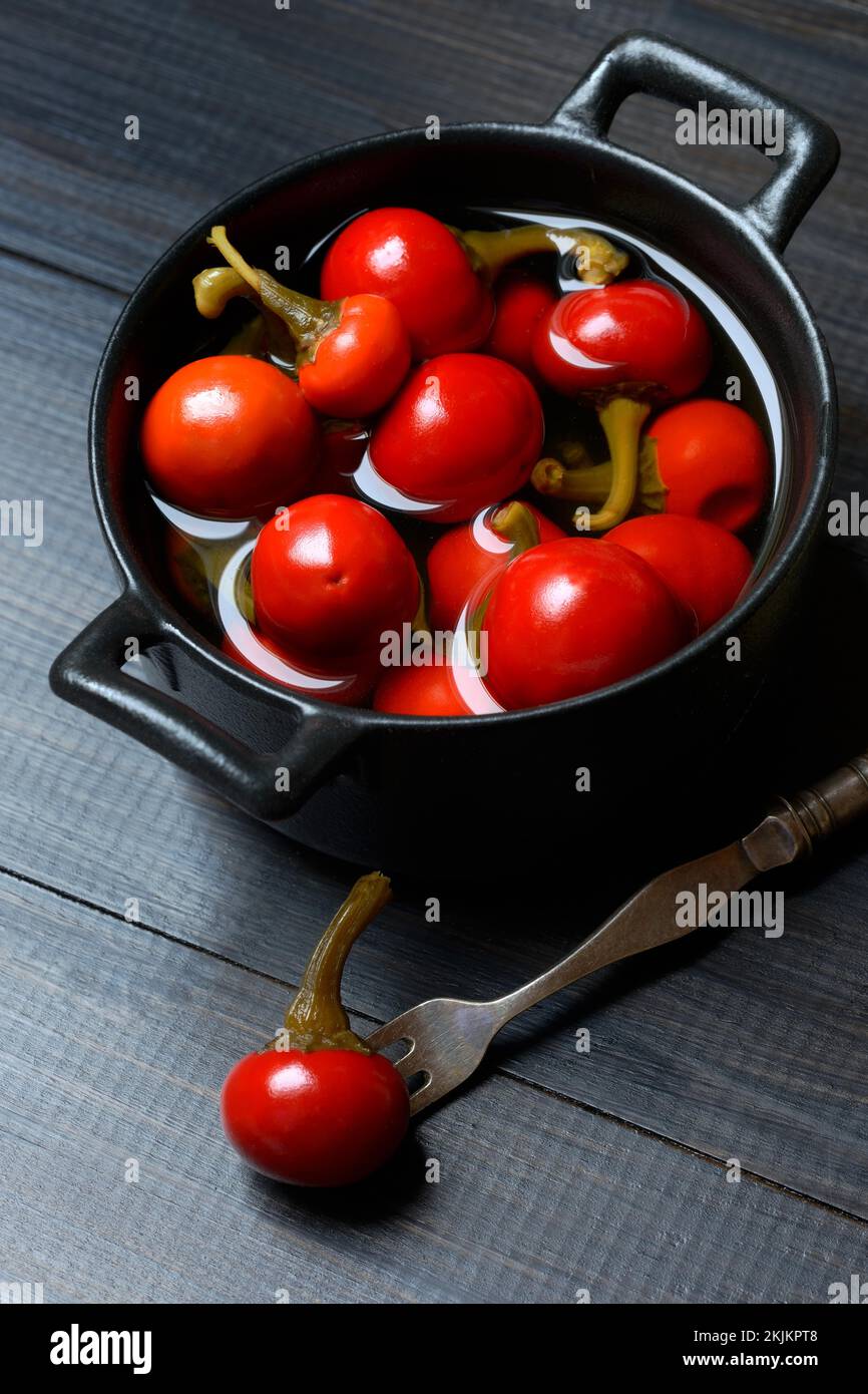 Potted cherry peppers in vinegar, chilli, paprika Stock Photo - Alamy