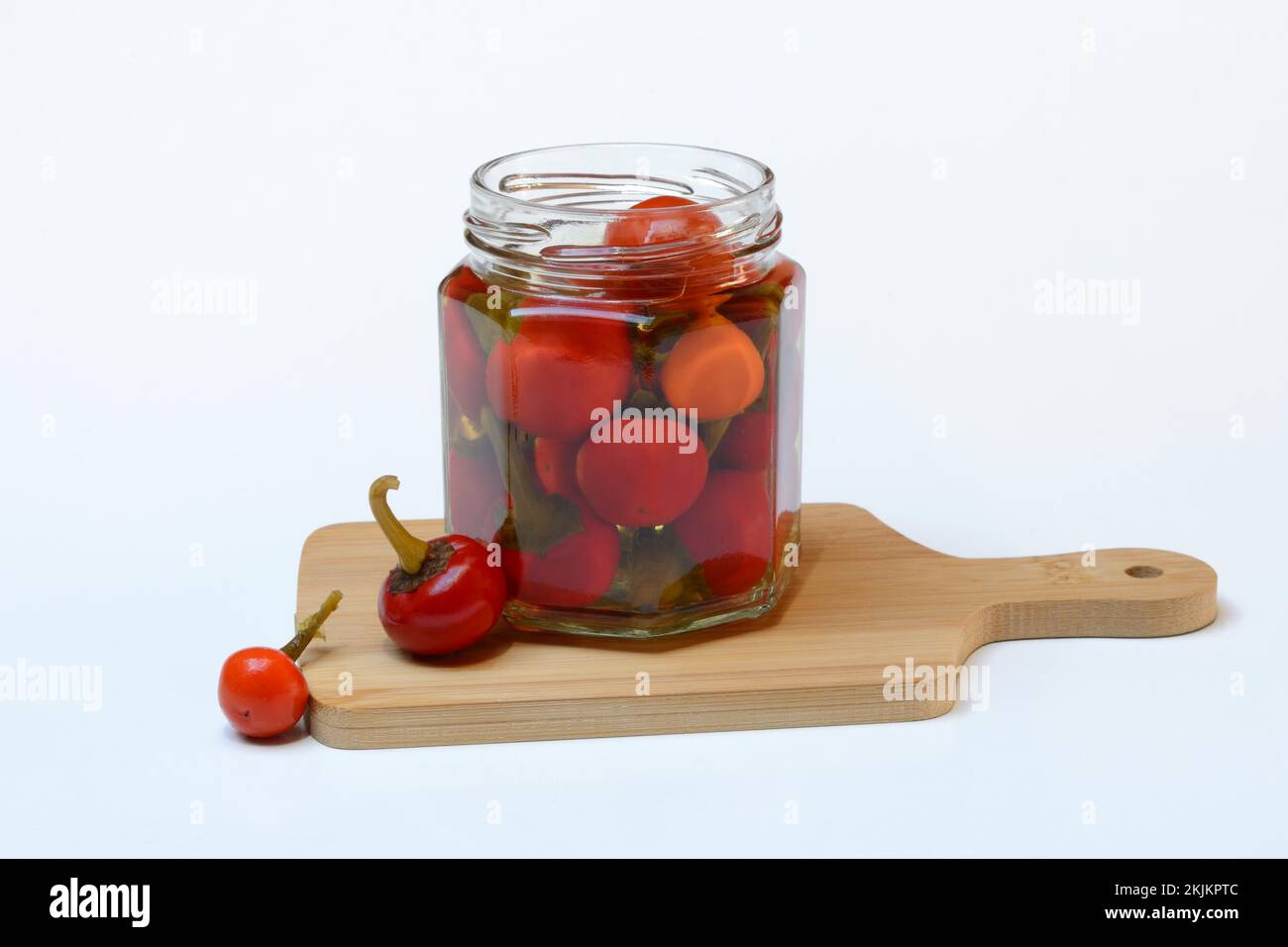 Jarred cherry peppers in vinegar, chilli, paprika Stock Photo - Alamy