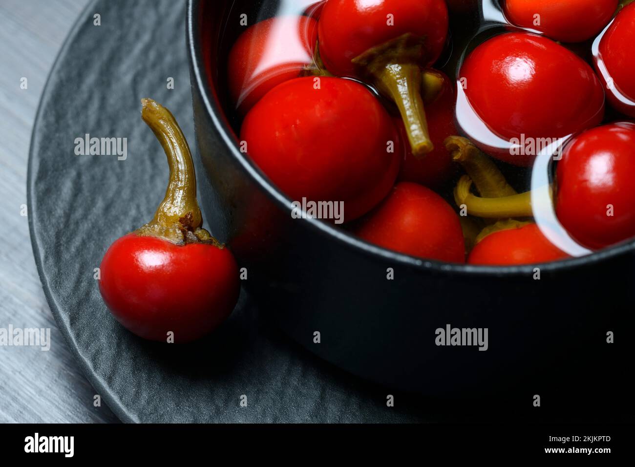 Potted cherry peppers in vinegar, chilli, paprika Stock Photo - Alamy