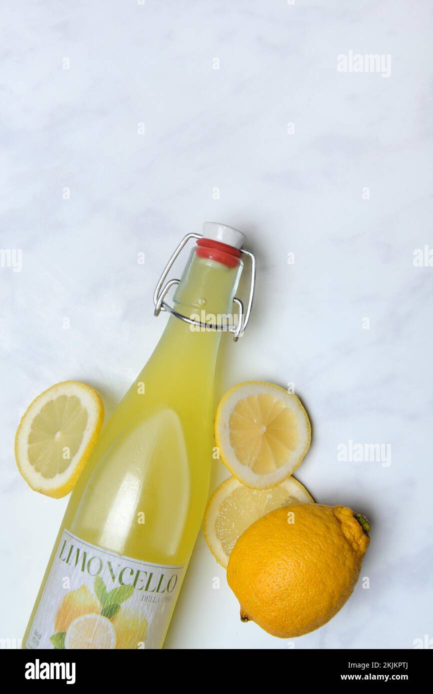 Limoncello, lemon liqueur in bottle and lemons Stock Photo - Alamy