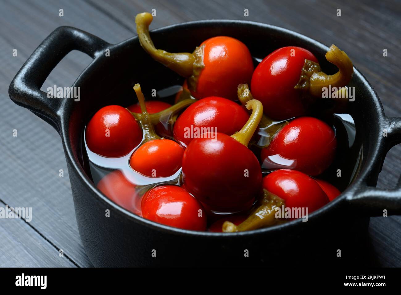 Potted cherry peppers in vinegar, chilli, paprika Stock Photo - Alamy