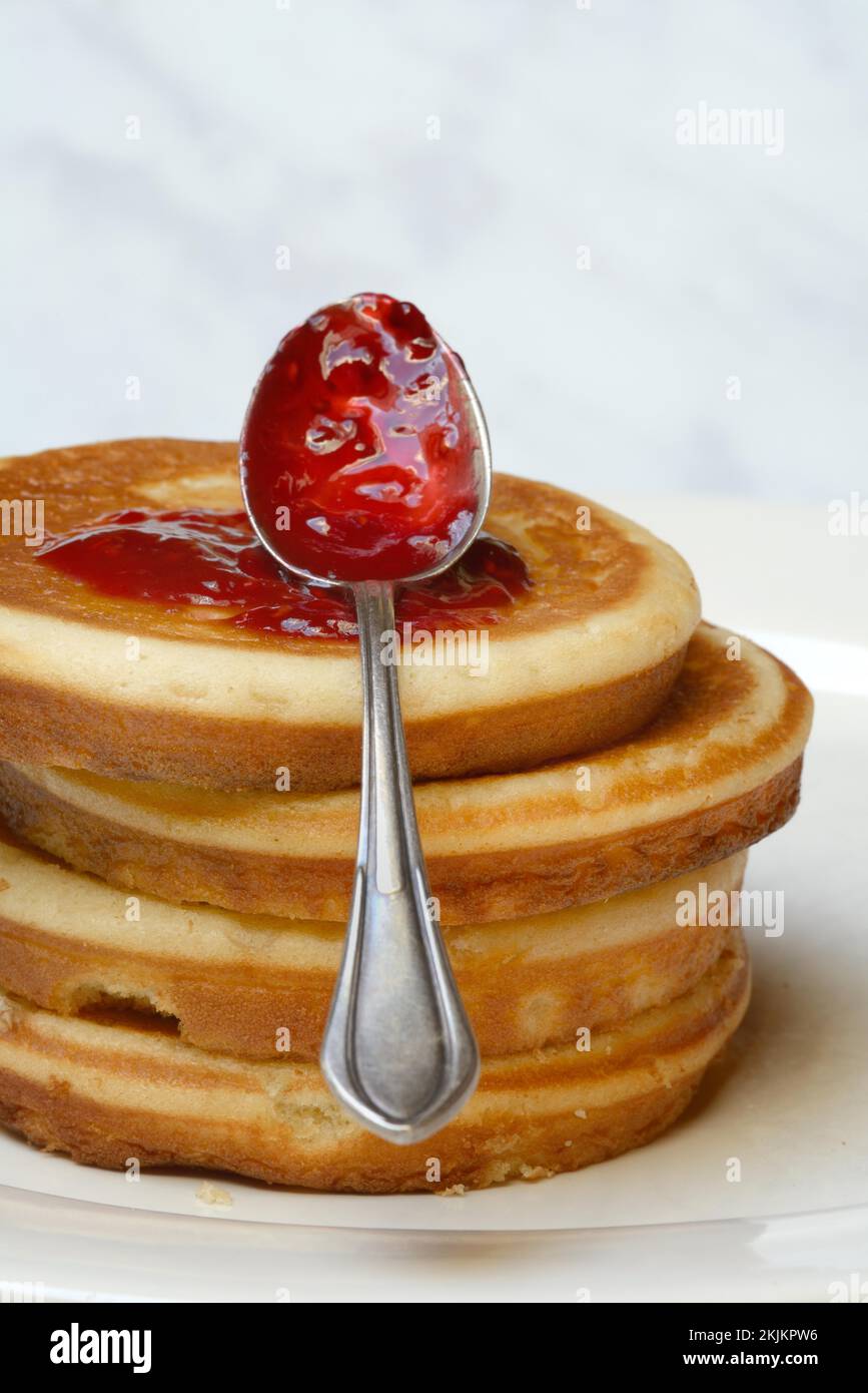 Pancake with raspberry jam and spoon Stock Photo - Alamy