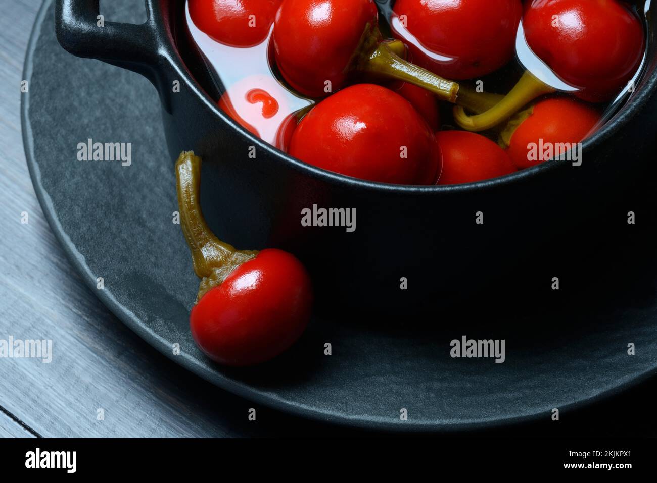 Potted cherry peppers in vinegar, chilli, paprika Stock Photo - Alamy