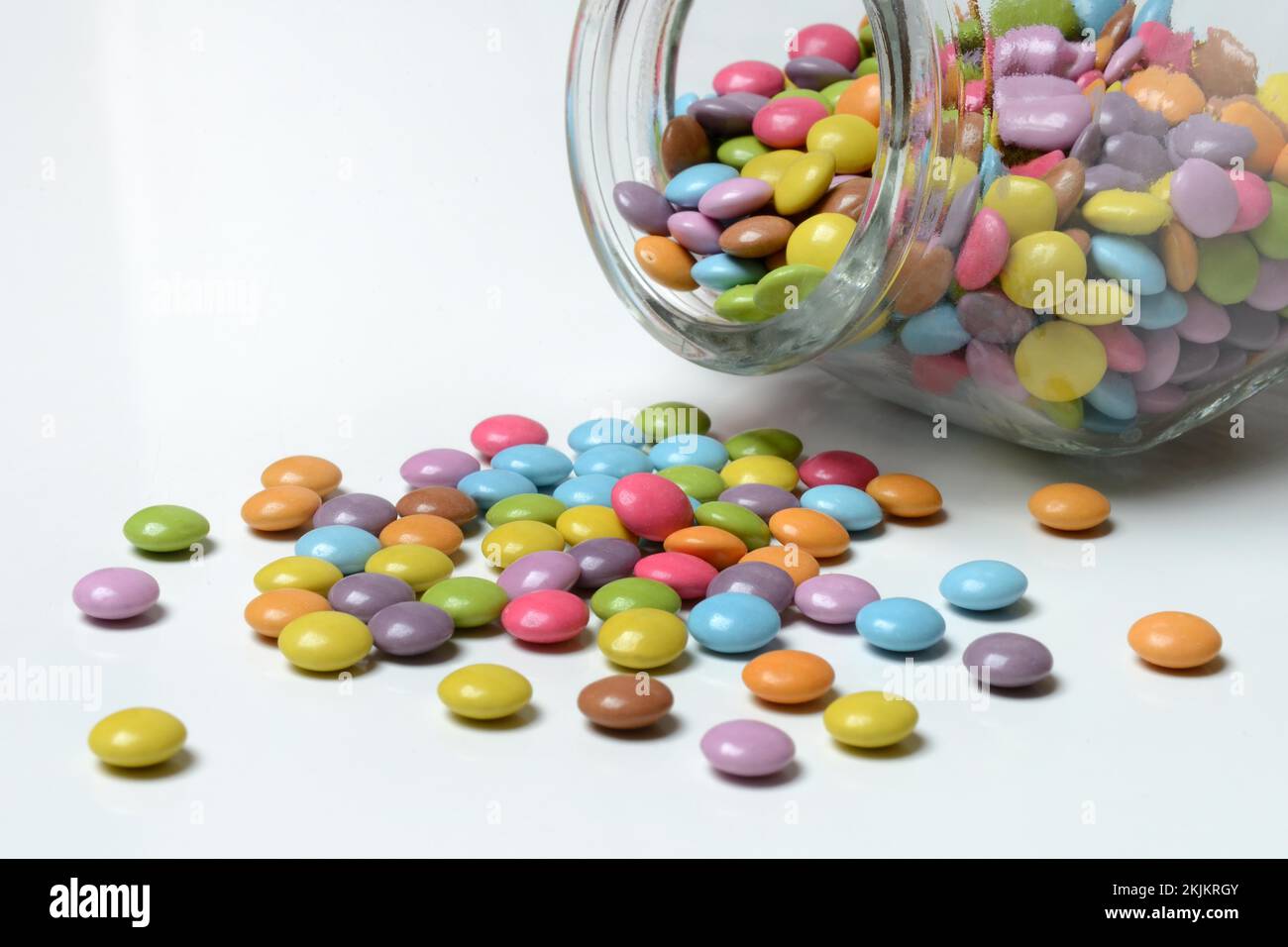 Chocolate lentils with glass container, Smarties Stock Photo - Alamy