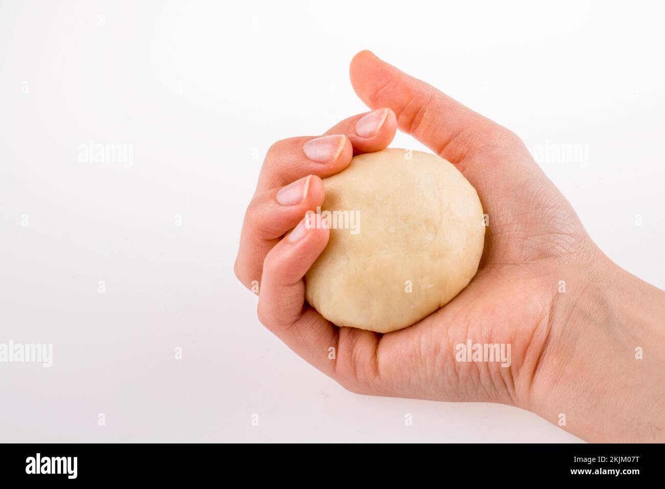 Hand holding paste on a white background Stock Photo - Alamy