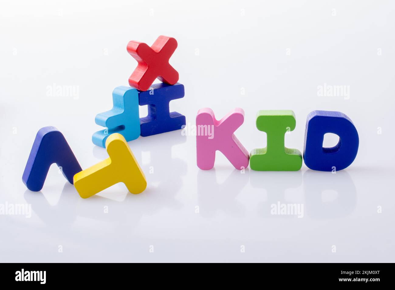 The word KID written with colorful letter blocks on white Stock Photo ...