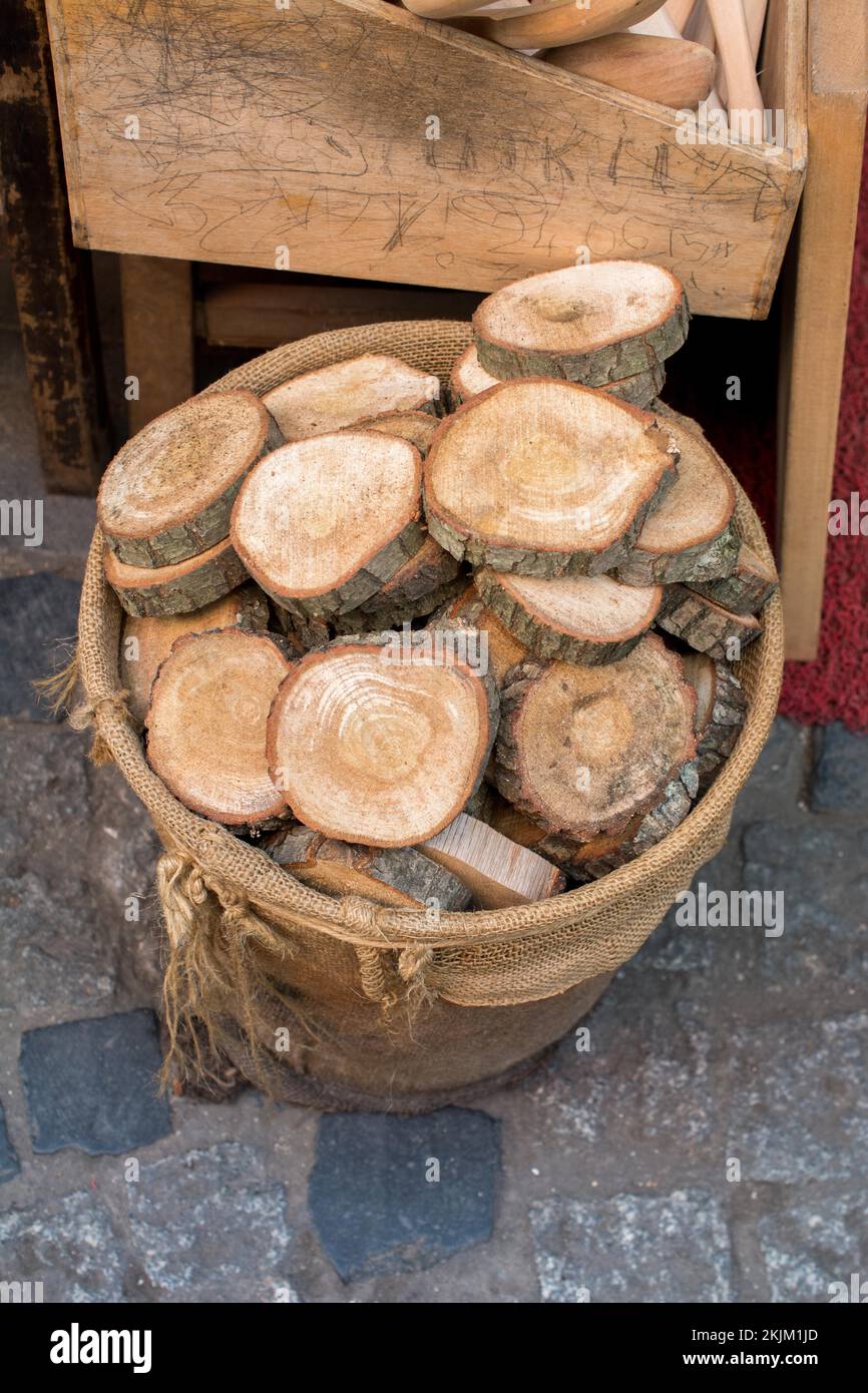 Wood Log cut in round thin pieces in view Stock Photo - Alamy