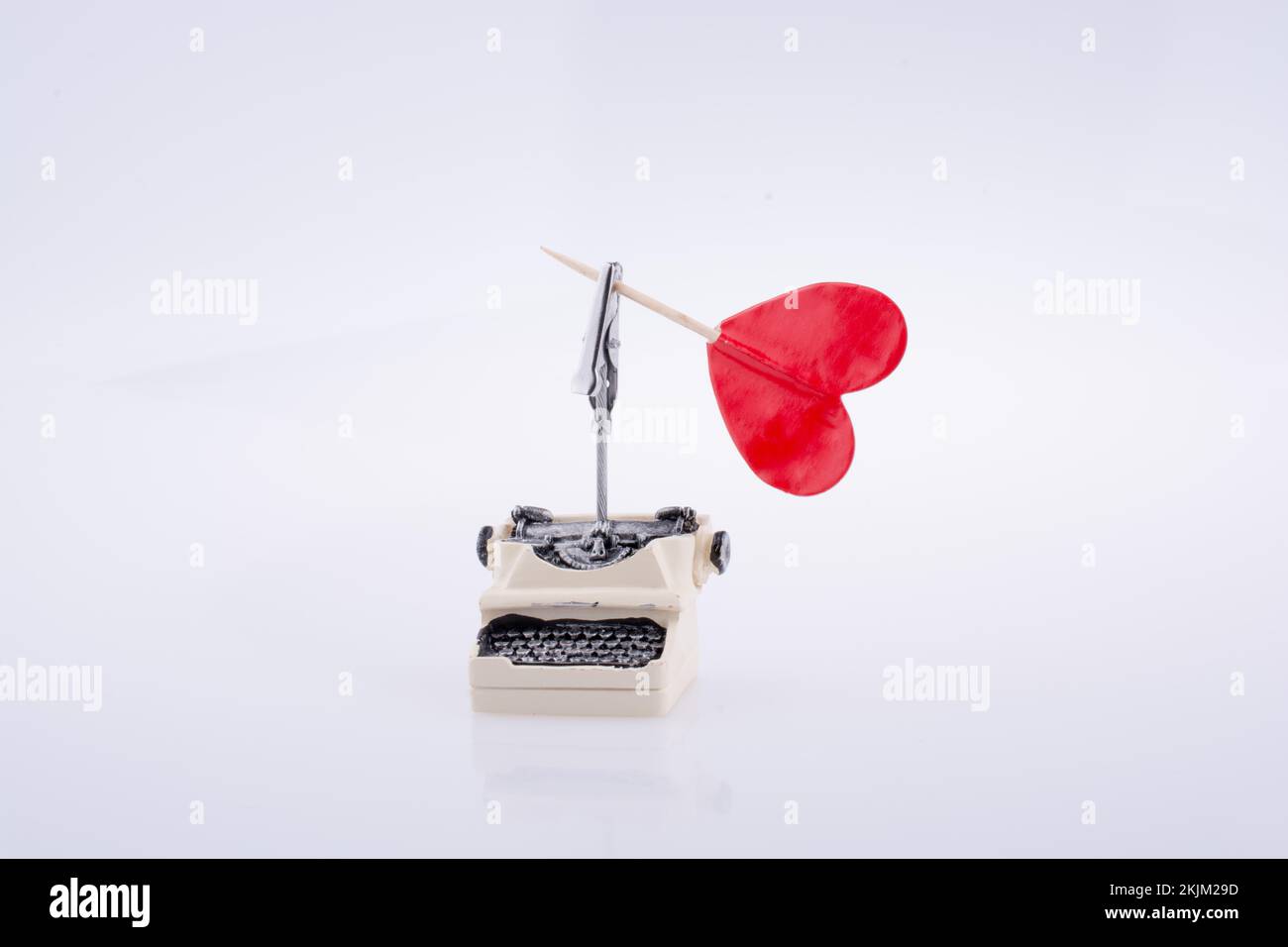 Heart shape icon on a typewriter on white background Stock Photo - Alamy