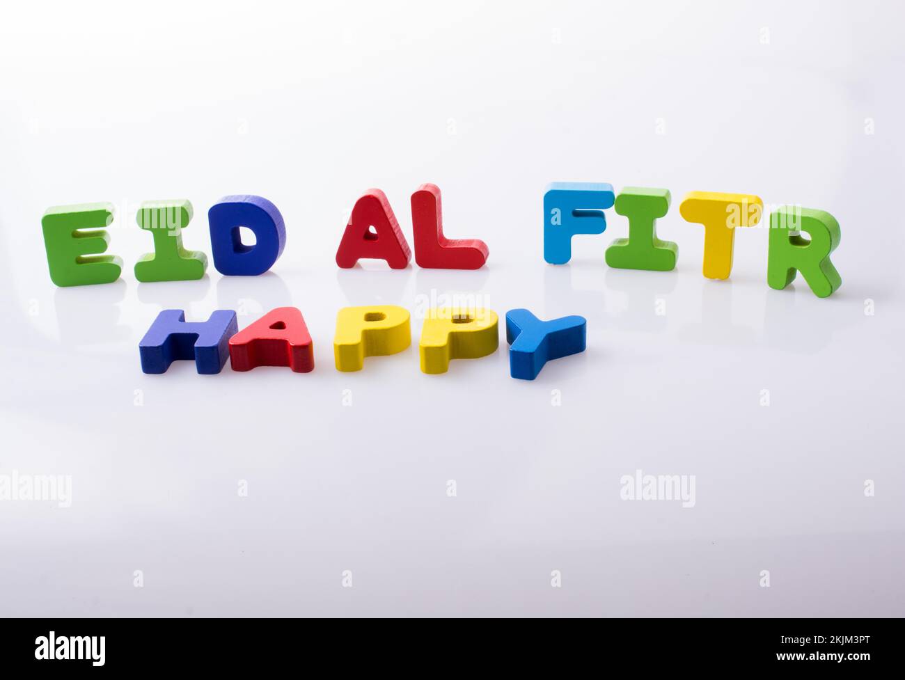 The word EID EL FITR written with colorful letter blocks Stock Photo ...
