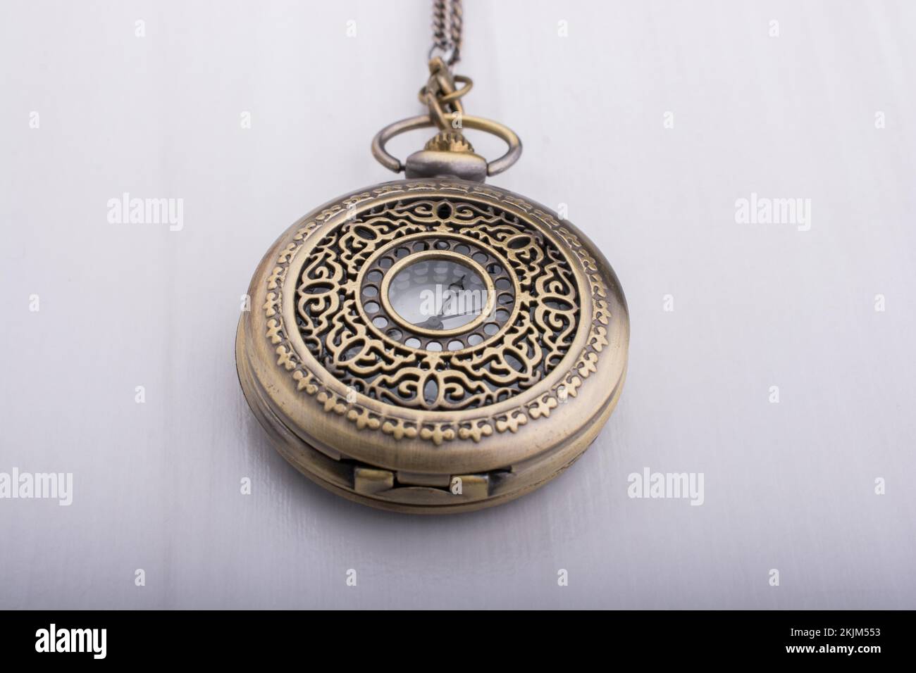 Retro style pocket watch on white background Stock Photo - Alamy