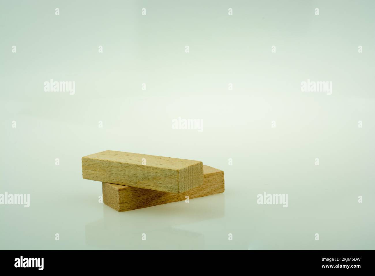 Wooden domino pieces positioned on white background Stock Photo - Alamy