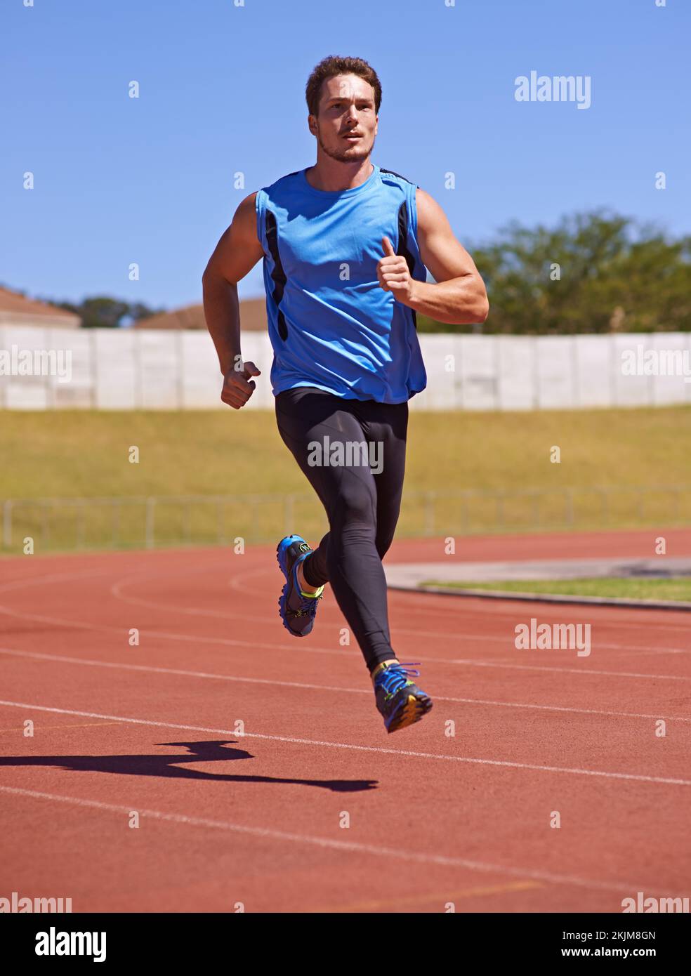 This track is my home. a young male athlete running on the track Stock ...