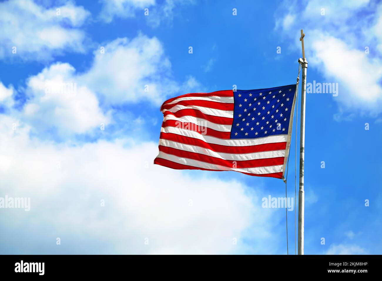 American flag on Route 66 with crucifix on top. Williams, Arizona, USA ...