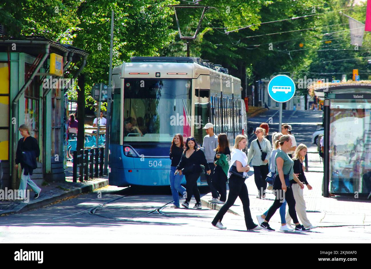 The people crossing the street in the avenue in Goteborg city, Avenyn ...