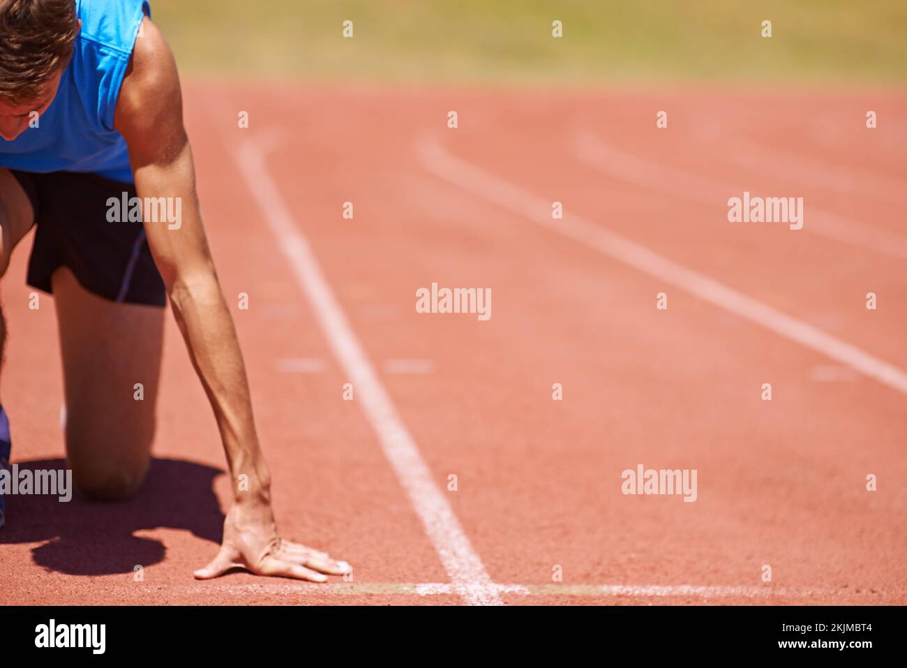 Im ready for this. a young male athlete at the start of a track race ...