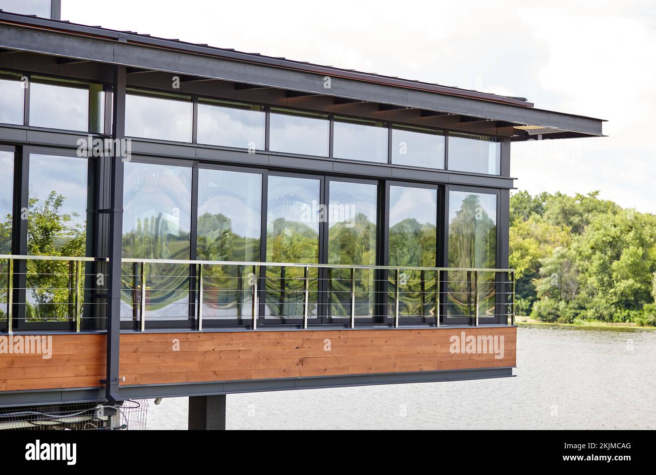 View of overwater restaurant. Building over the river against the ...