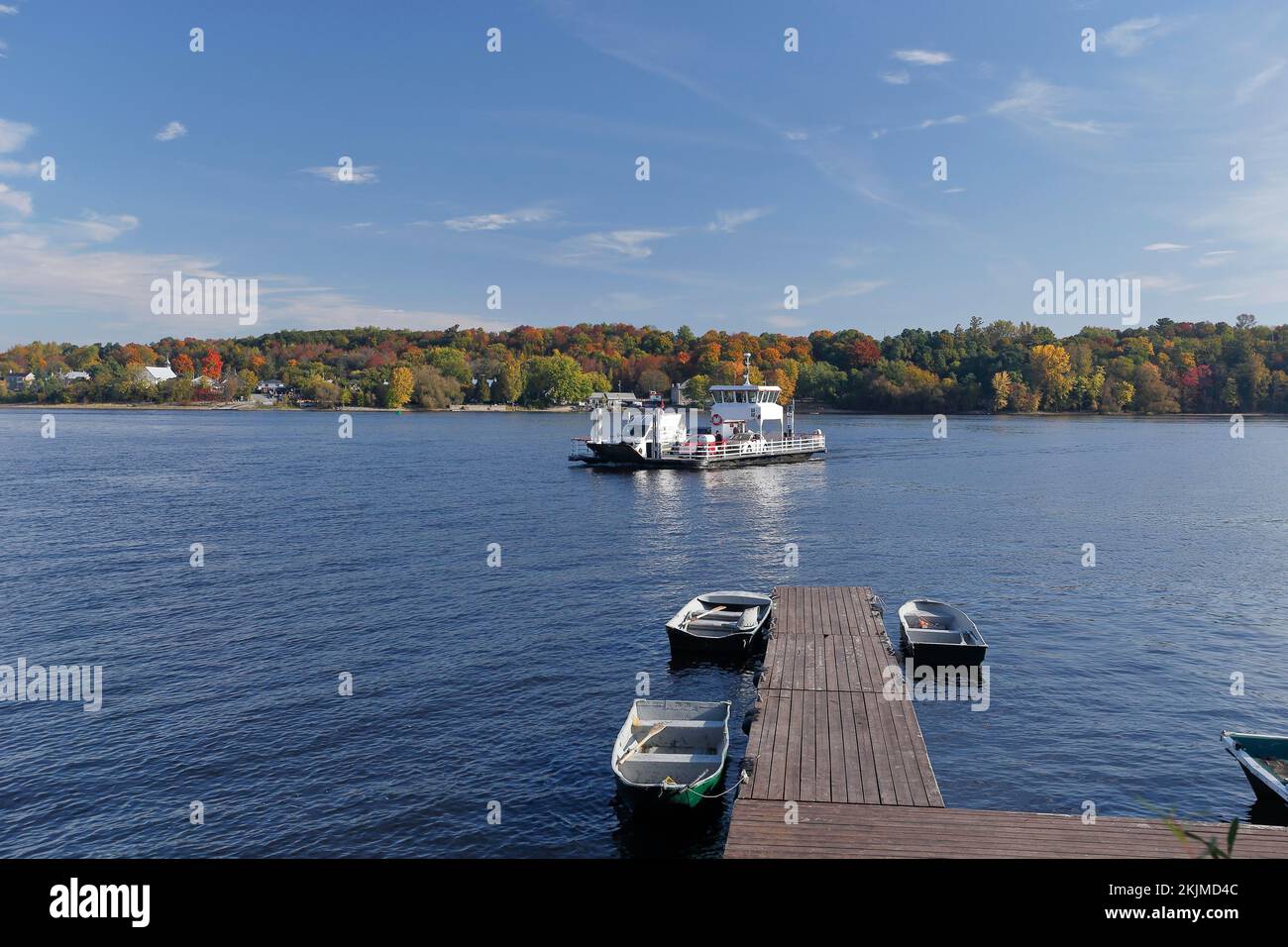 Small ferry boat crossing the Ottawa River, Province of Quebec, Canada ...