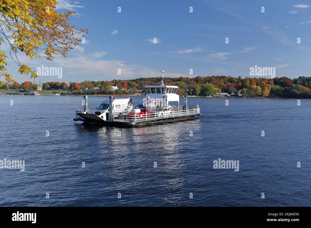 Small ferry boat crossing the Ottawa River, Province of Quebec, Canada ...