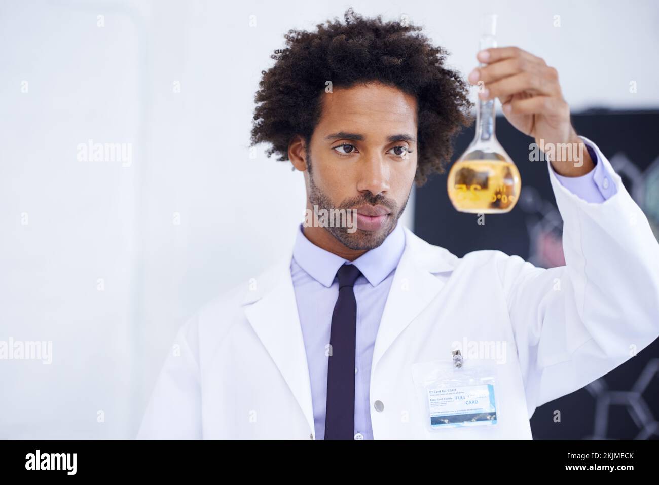 Chemistry is cool. a handsome male scientist conducting an experiment in his lab Stock Photo - Alamy