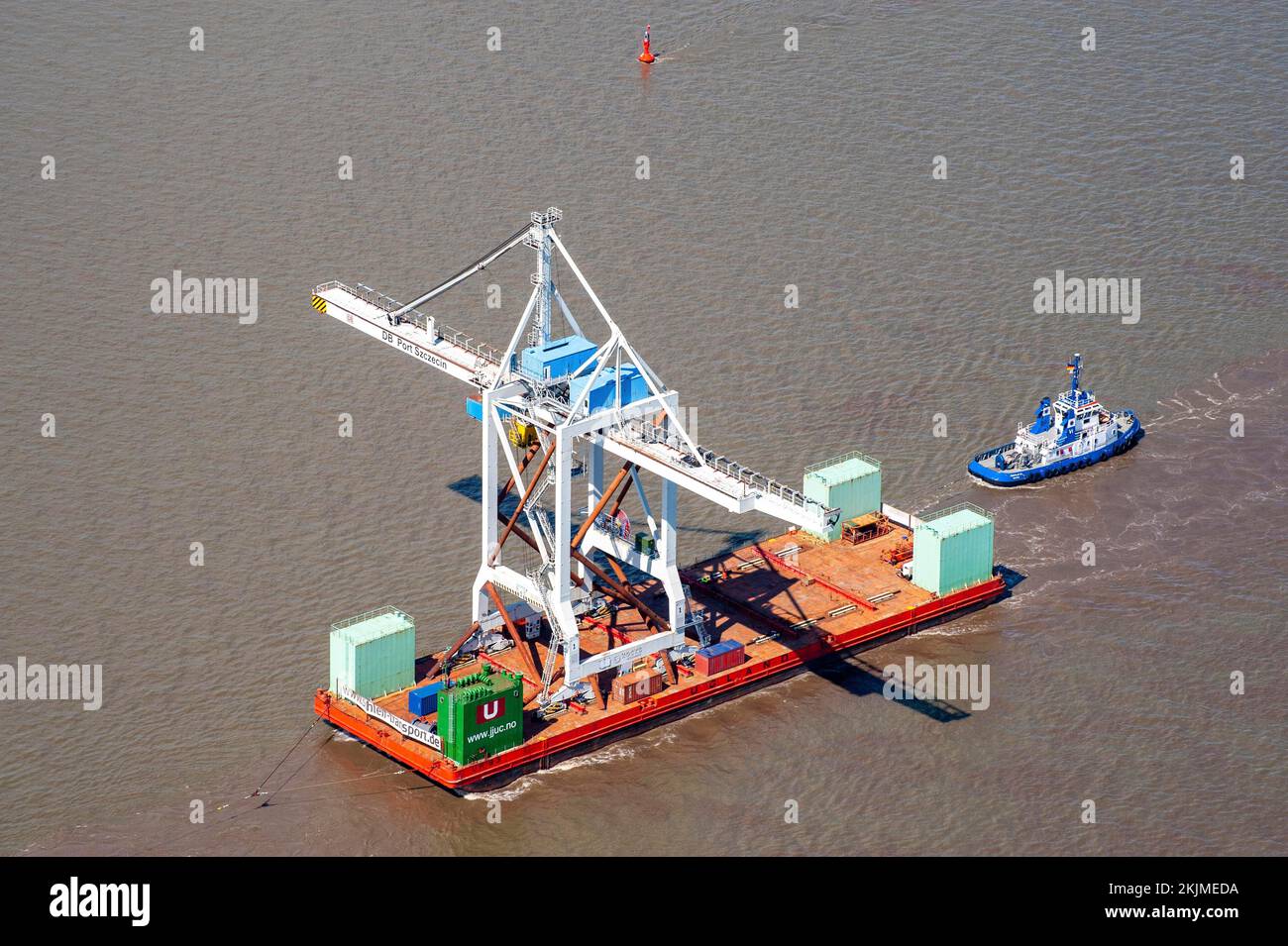 Tugboat with heavy load on a pontoon on the Elbe, ship, pontoon ...