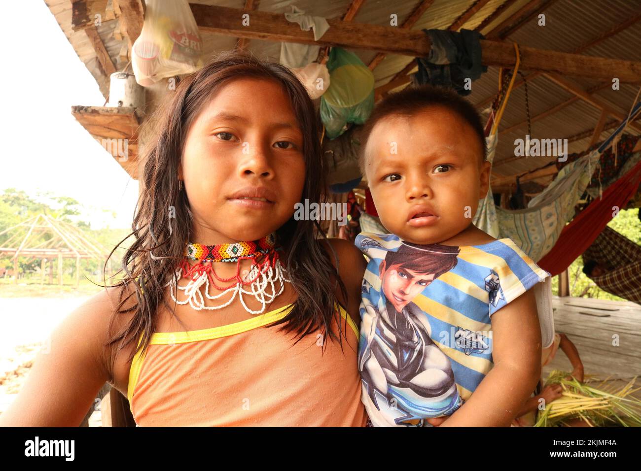 Indigenous people, girl of the indigenous people Huni Kuin carrying ...