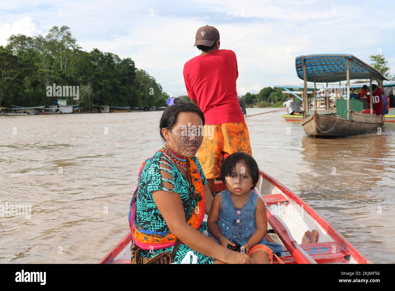 Indigenous people, Huni Kuin family in a boat on the Jordão River in ...
