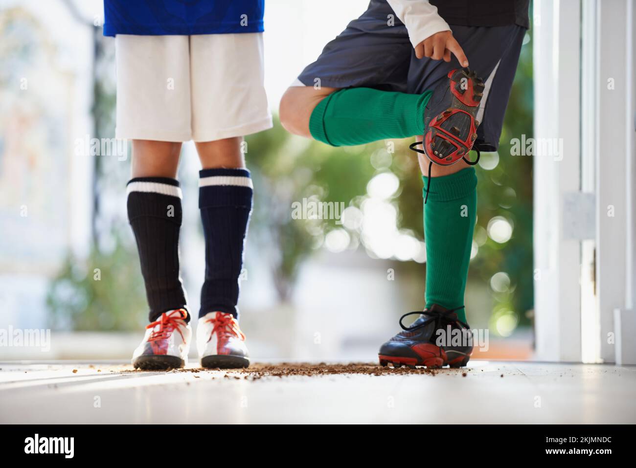 Oops Moms not going to be happy about that. two boys in sports clothing ...