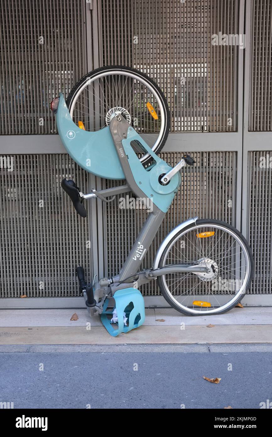 An upside down blue bike in street Stock Photo - Alamy