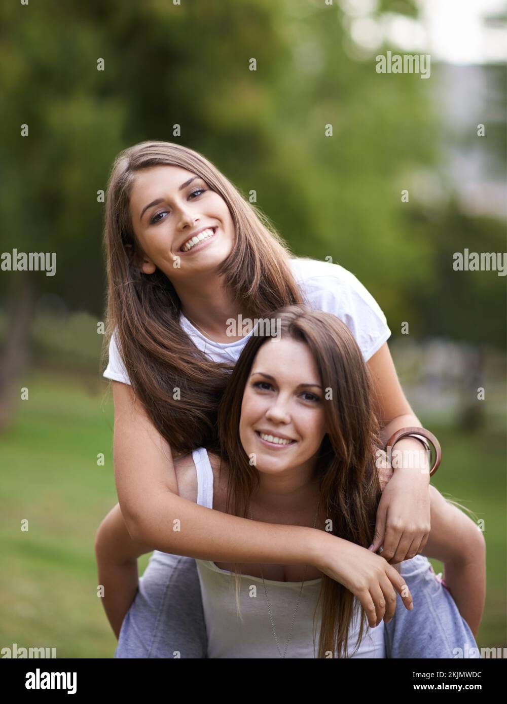 Giving my best friend a lift. Portrait of a young woman giving her ...