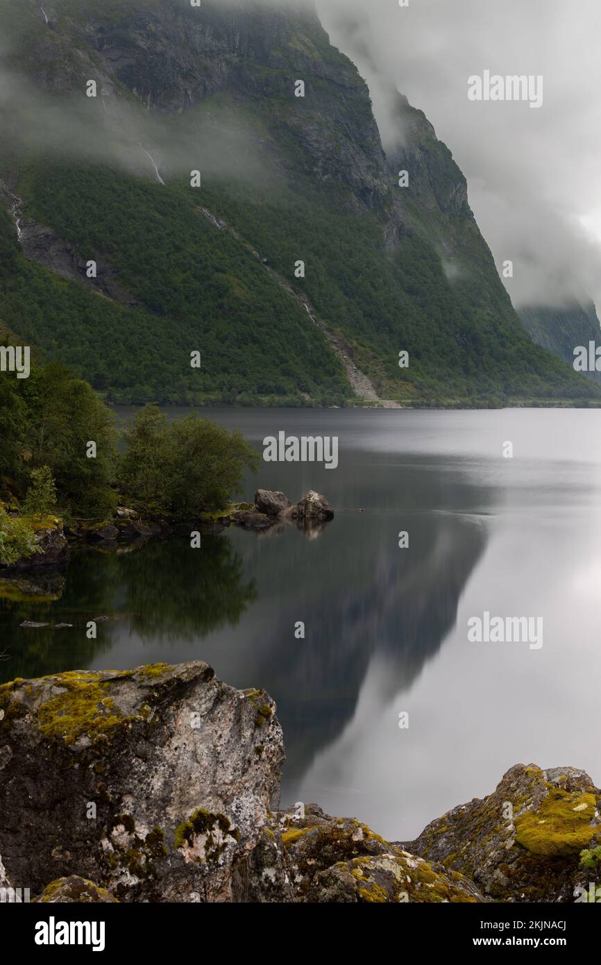 A clear clam lake near the mountain in Norway Stock Photo - Alamy