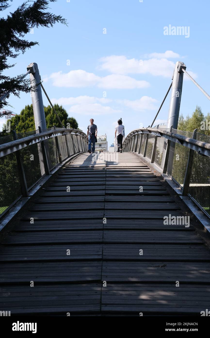 A view of people walking on bridge in Paris Stock Photo - Alamy