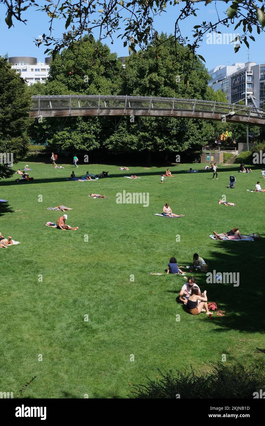 An aerial view people sitting and laying in a small park in Paris Stock ...