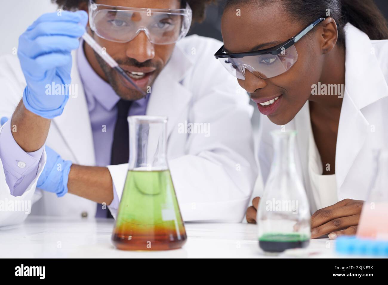 Lets see what happens if we do this...two scientists conducting an ...