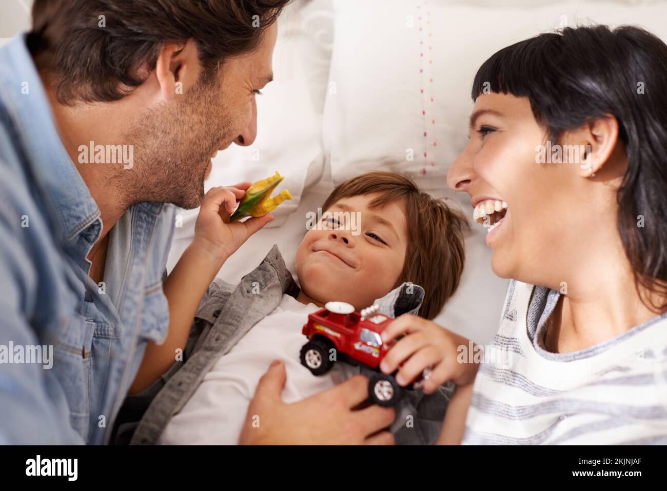 These are the moments that matter. happy parents bonding with their son ...