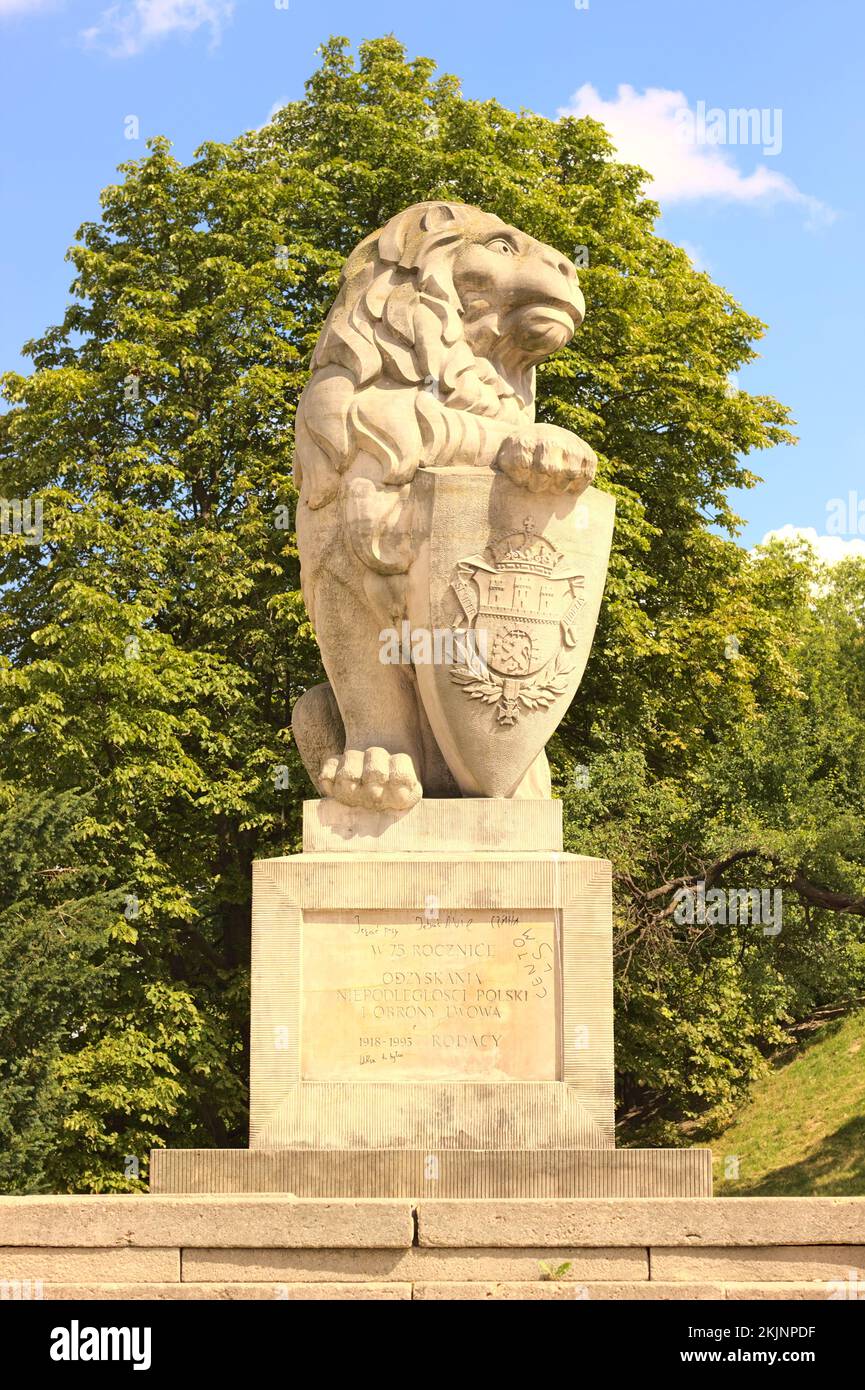 A lion statue "The Symbol of Lviv" holding a shield in Lublin Stock ...